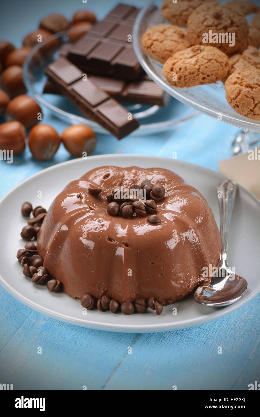 chocolate pudding with ingredients around on the table blue Stock Photo ...