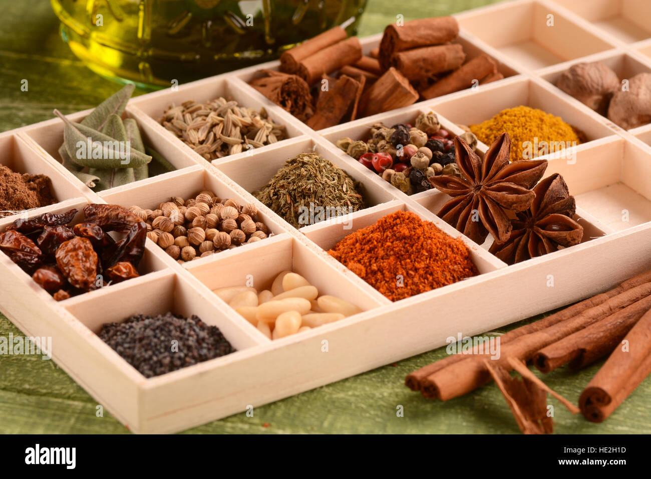 assorted spices in a wooden box on the table Stock Photo - Alamy