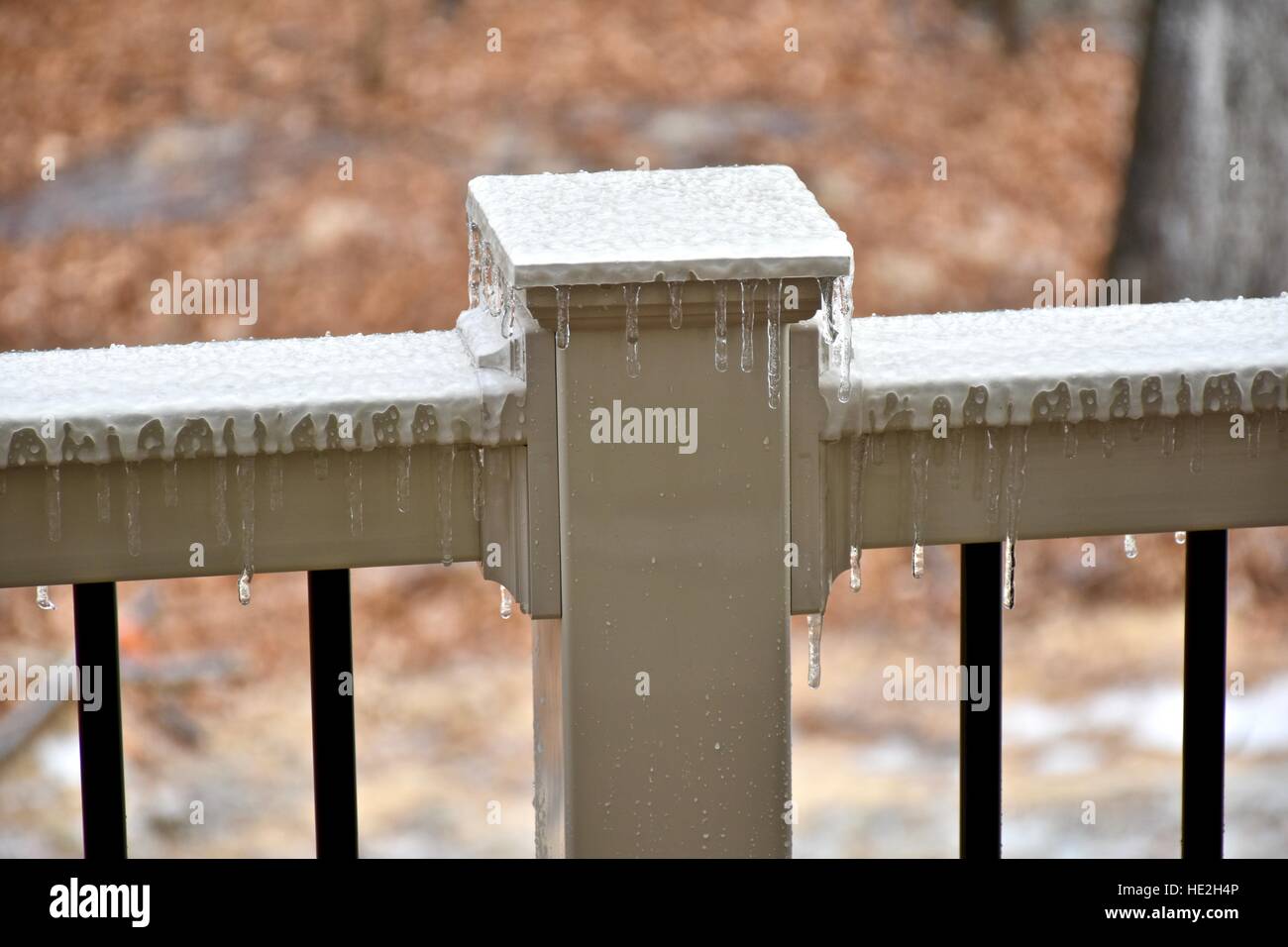 Ice cycles hanging from the deck of a home after a cold winter storm ...