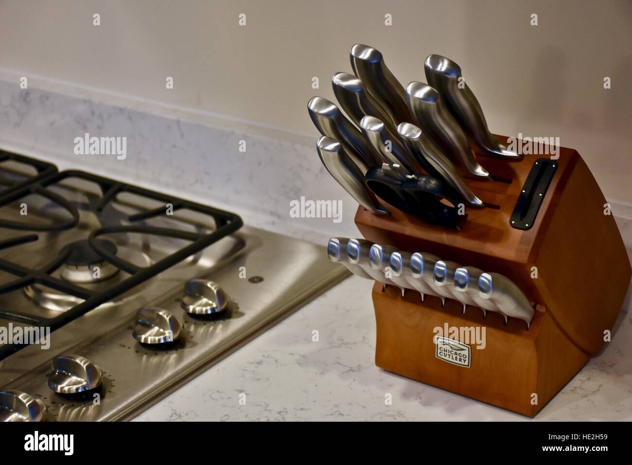 A stainless steel knife set on a beautiful marble counter Stock Photo ...