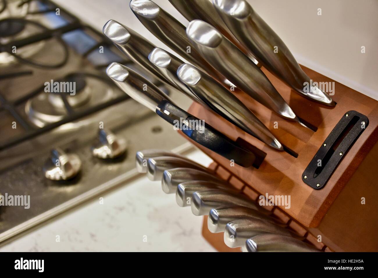 A stainless steel knife set on a beautiful marble counter Stock Photo ...