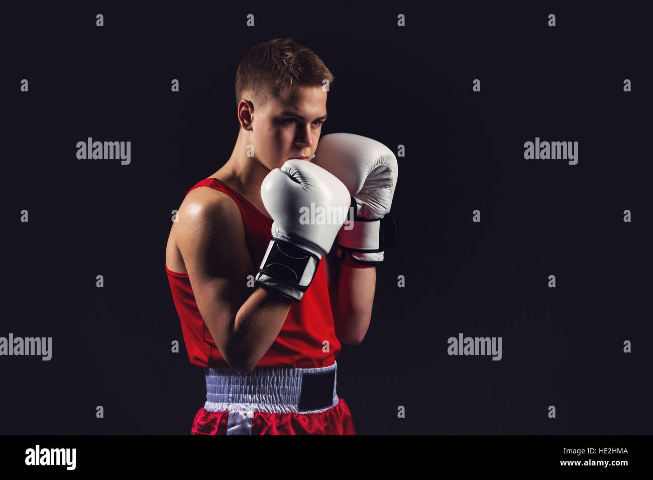 Young boxer sportsman in red sport suit Stock Photo - Alamy