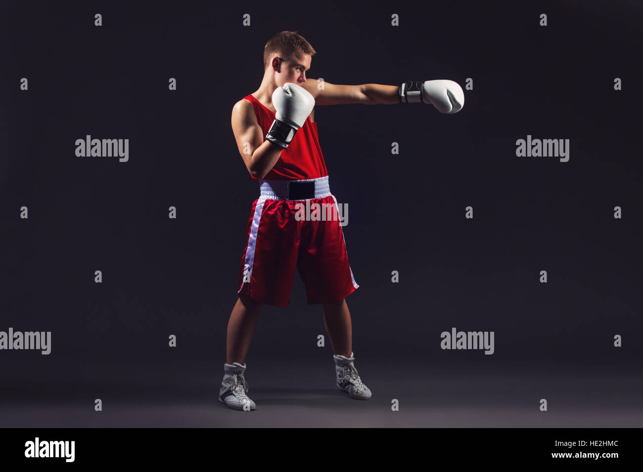 Young boxer sportsman in red sport suit Stock Photo - Alamy