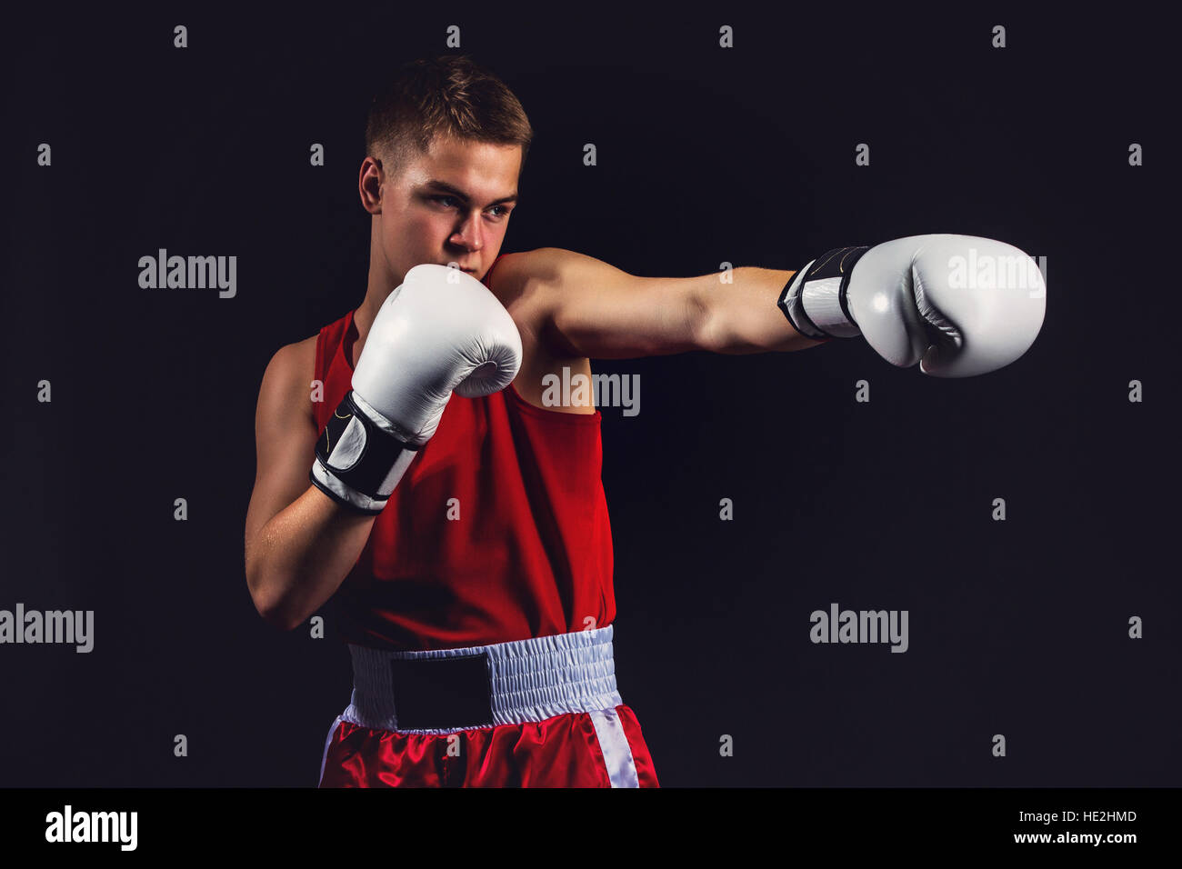 Young boxer sportsman in red sport suit Stock Photo - Alamy