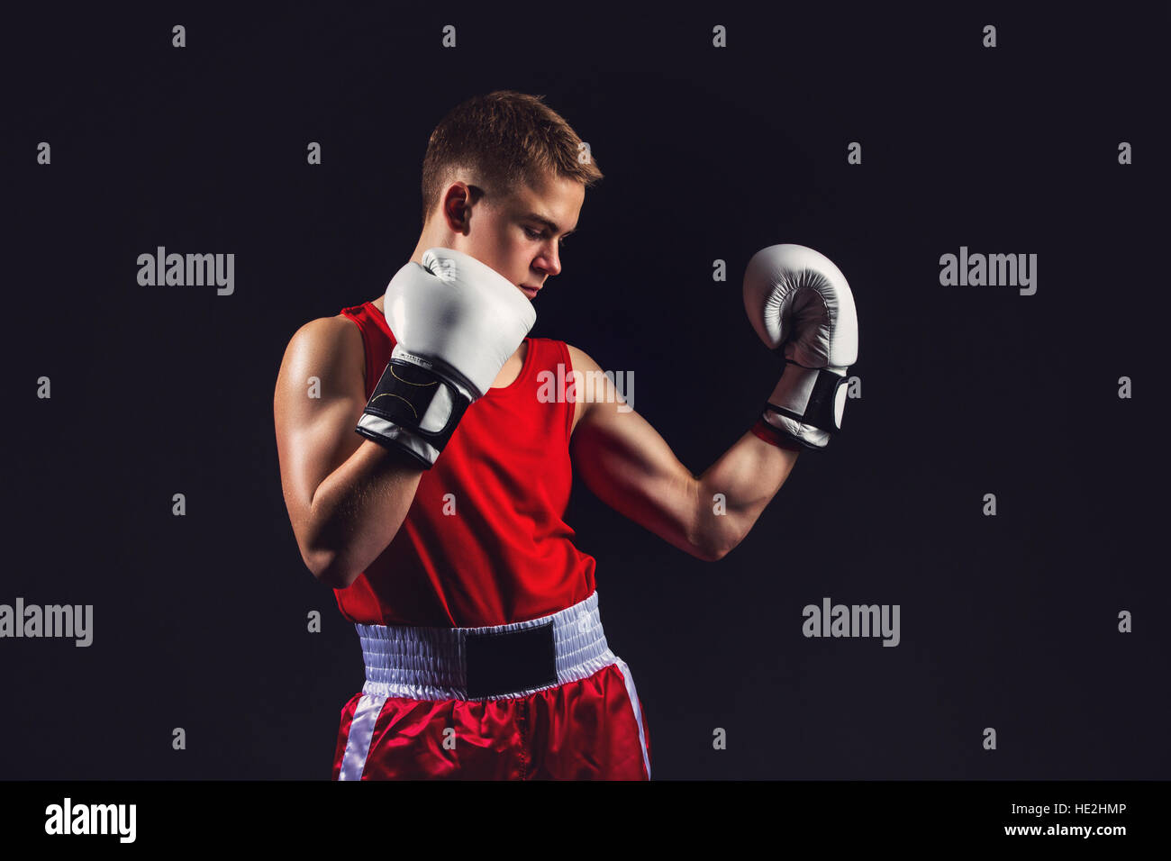 Young boxer sportsman in red sport suit Stock Photo - Alamy
