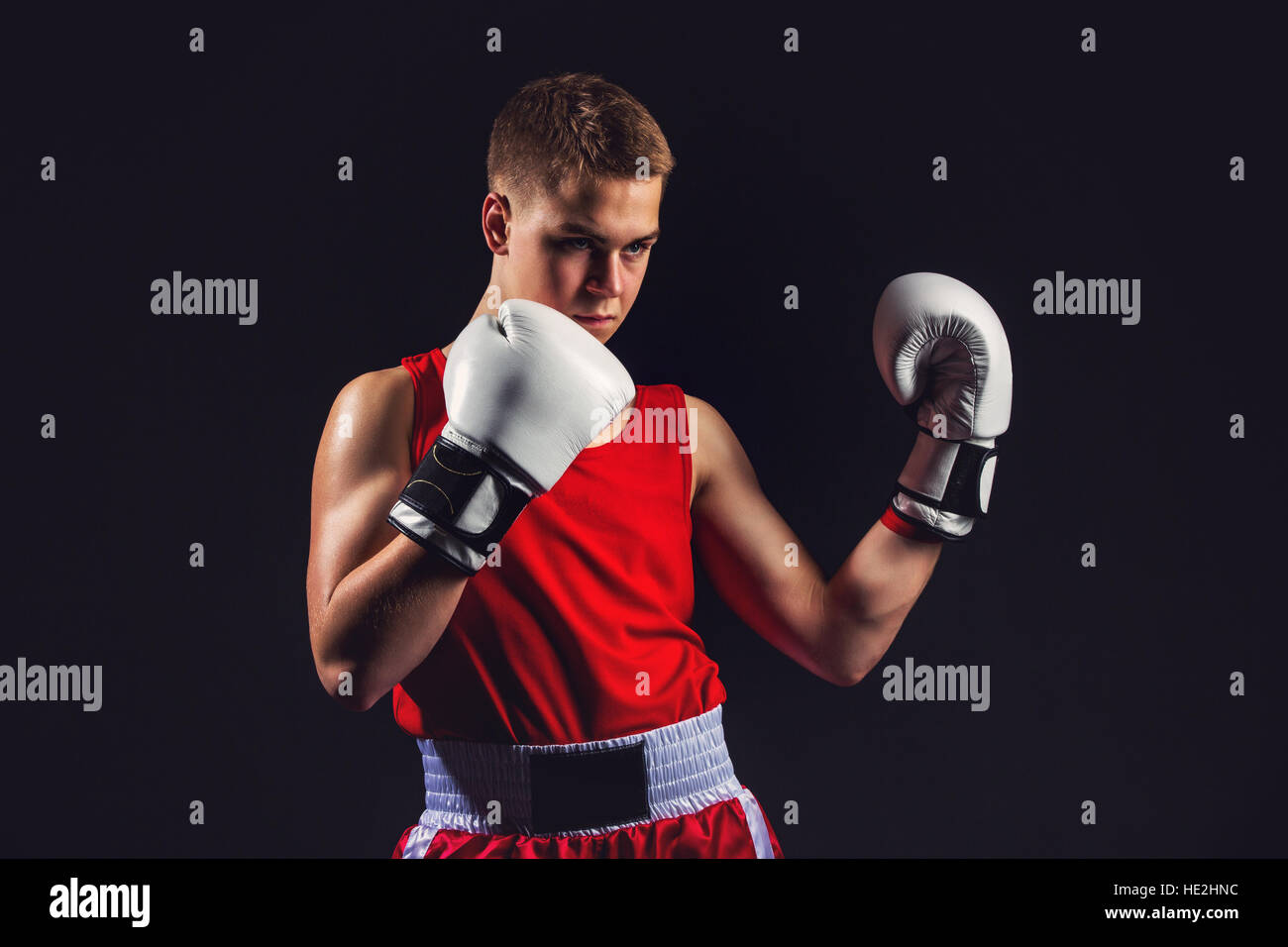 Young boxer sportsman in red sport suit Stock Photo - Alamy