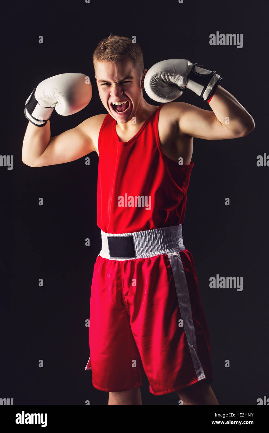 Young boxer sportsman in red sport suit Stock Photo - Alamy