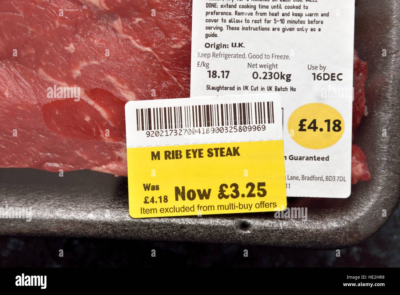 Rib eye steak with a price reduction sticker Stock Photo - Alamy