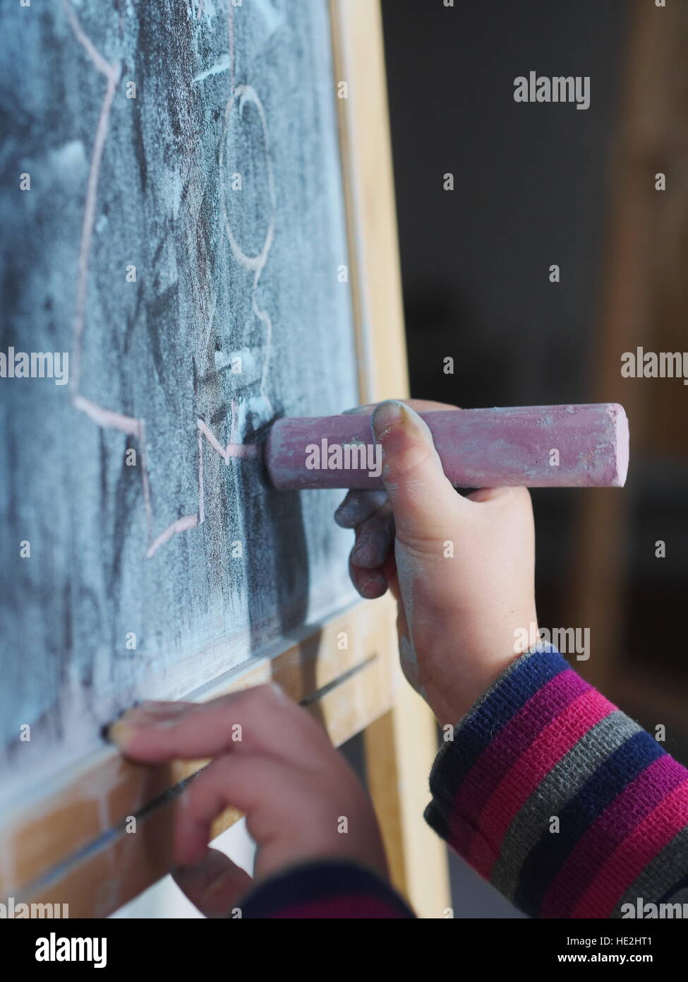 Child writing chalk Stock Photo - Alamy