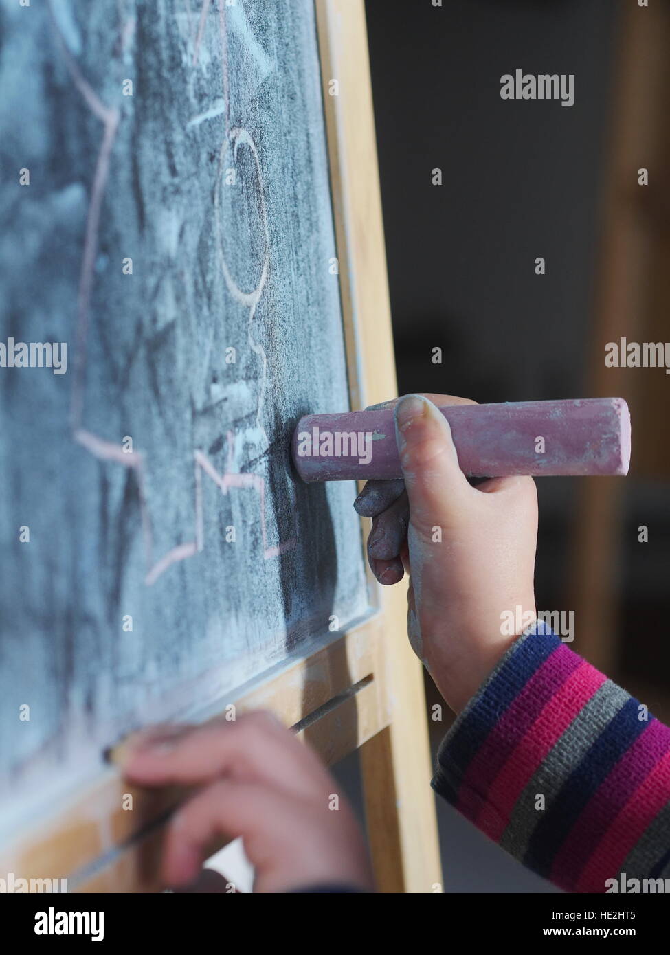 Child writing chalk Stock Photo - Alamy