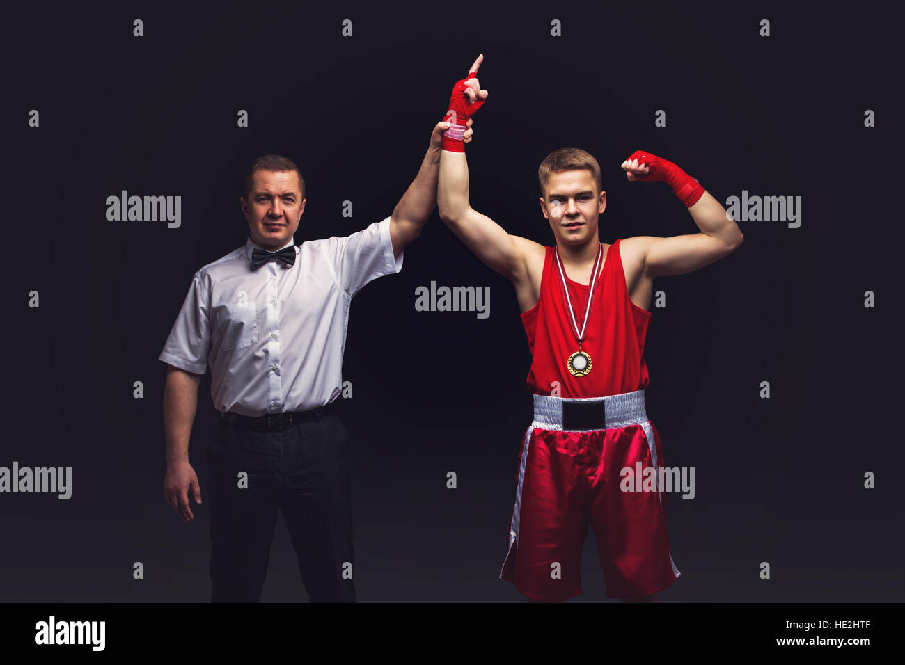 Boxing referee gives medal to young boxer Stock Photo - Alamy