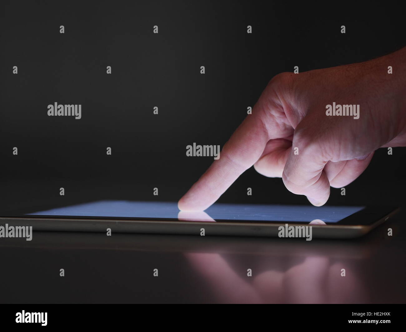 male hand touch digital tablet Stock Photo - Alamy
