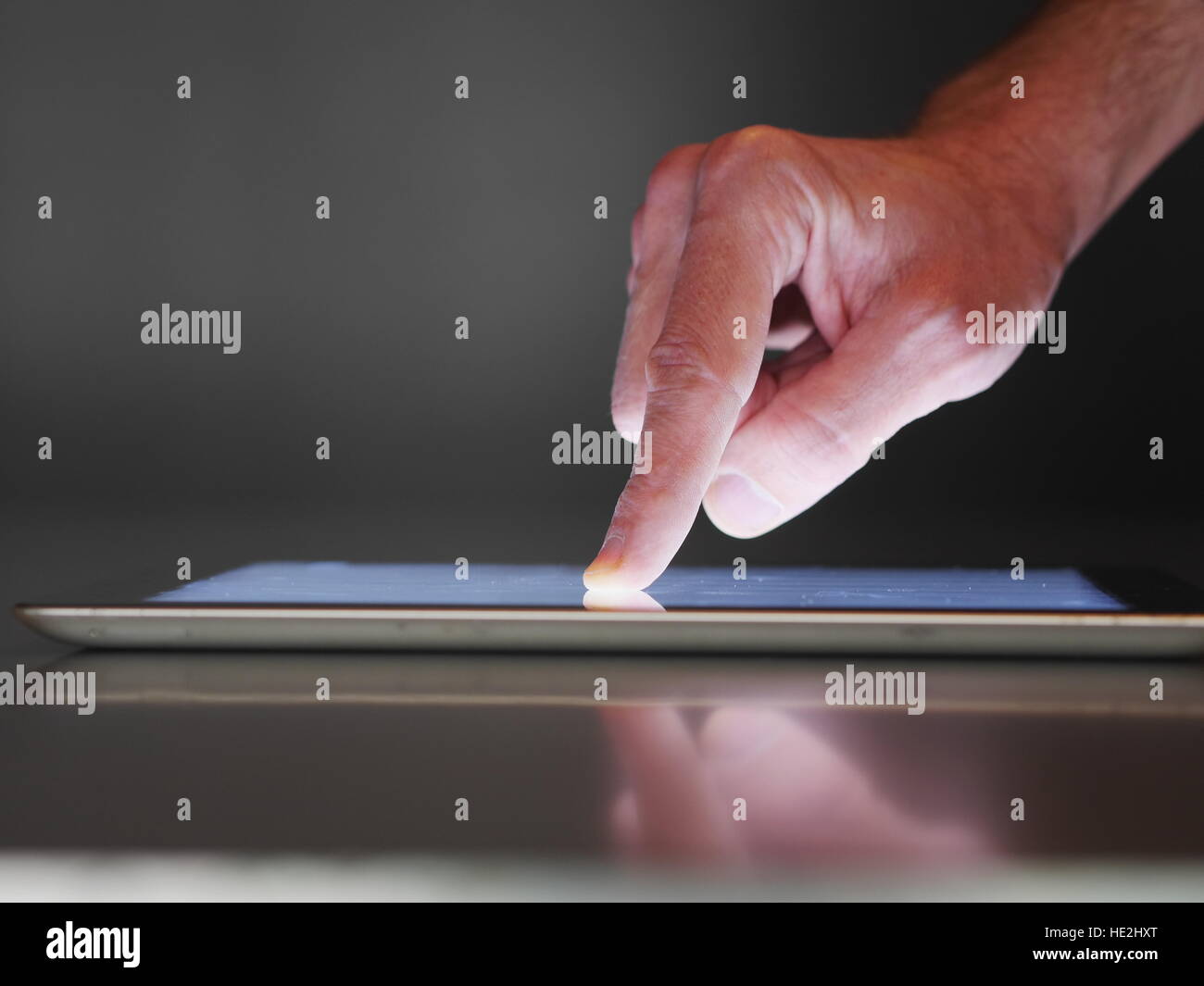 male hand touch digital tablet Stock Photo - Alamy