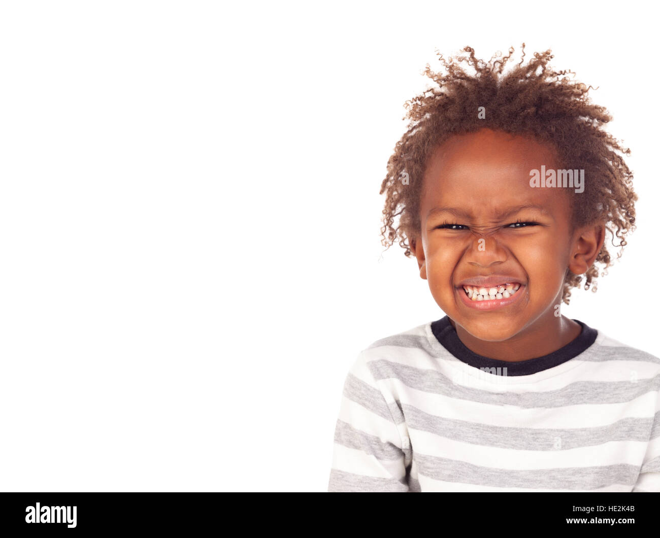 African child putting mean face isolated on white background Stock ...