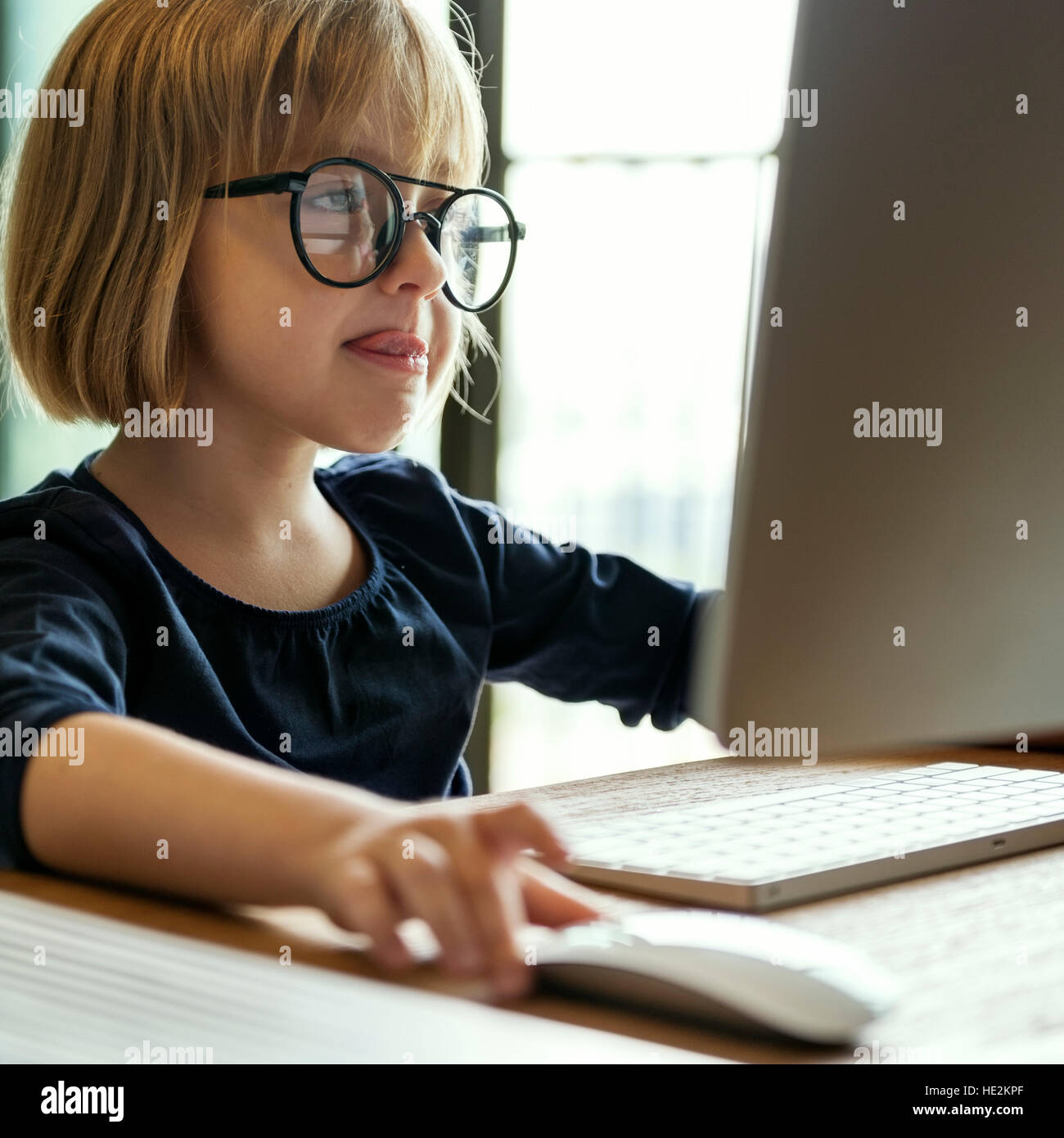 Little Girl Using Computer Concept Stock Photo - Alamy