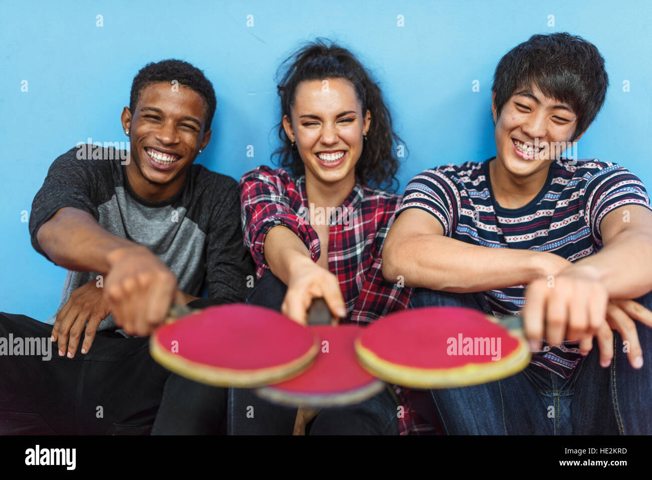 Diverse friends playing tennis hi-res stock photography and images - Alamy
