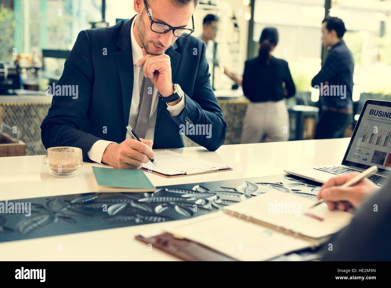 Serious Business Man Filling Out Form Concept Stock Photo - Alamy
