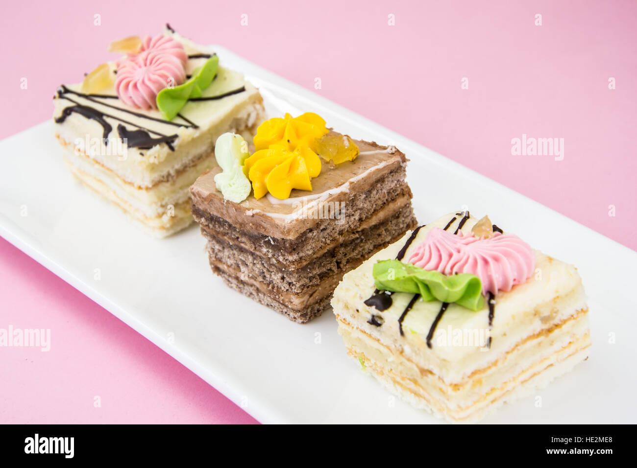 Sweets Cream Cakes on Plate Stock Photo - Alamy