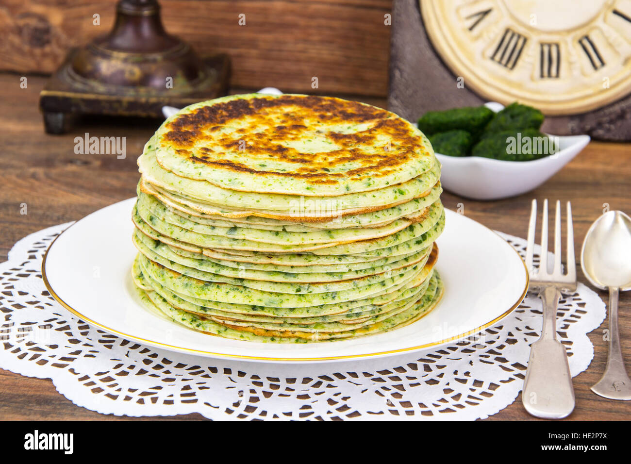 Tasty Pancakes Stack with Spinach Stock Photo - Alamy