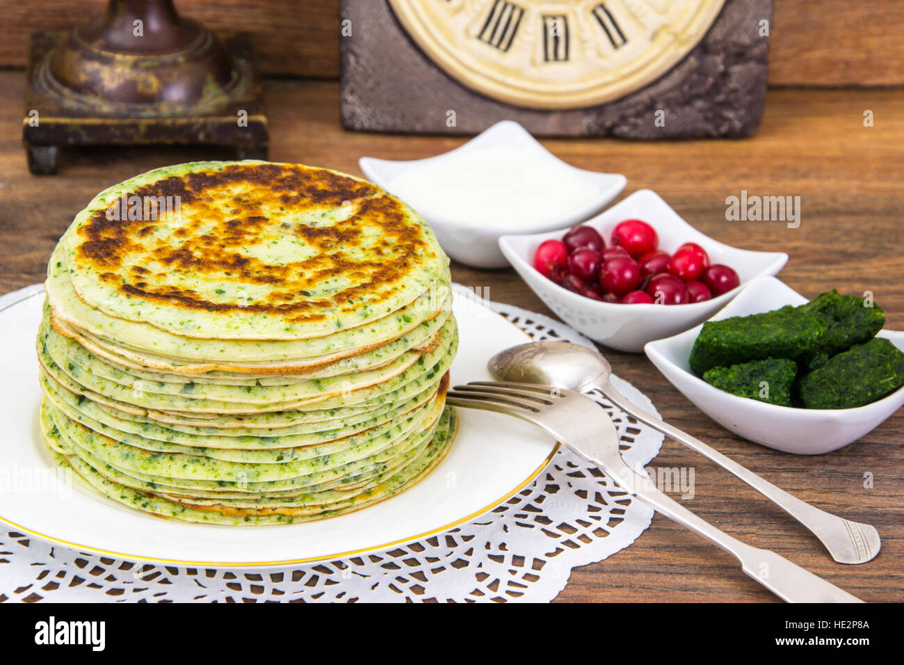 Tasty Pancakes Stack with Spinach Stock Photo - Alamy