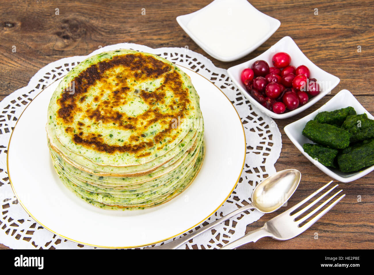 Tasty Pancakes Stack with Spinach Stock Photo - Alamy