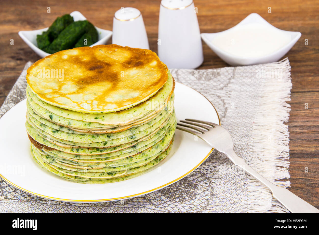 Tasty Pancakes Stack with Spinach Stock Photo - Alamy