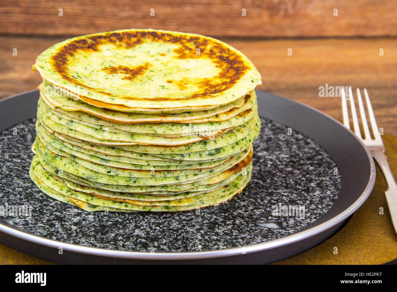 Tasty Pancakes Stack with Spinach Stock Photo - Alamy