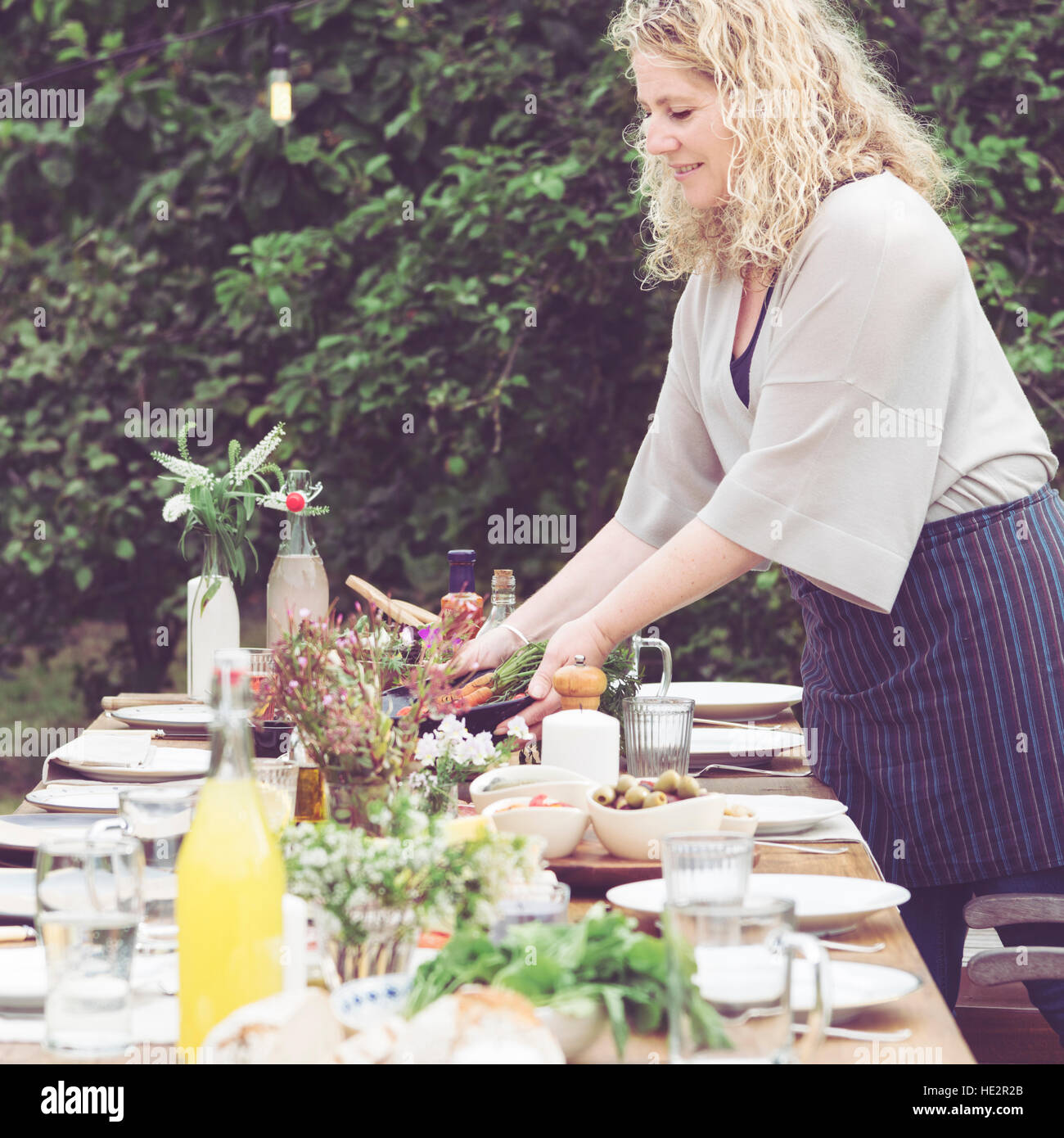 Woman Preparing Table Dinner Concept Stock Photo - Alamy