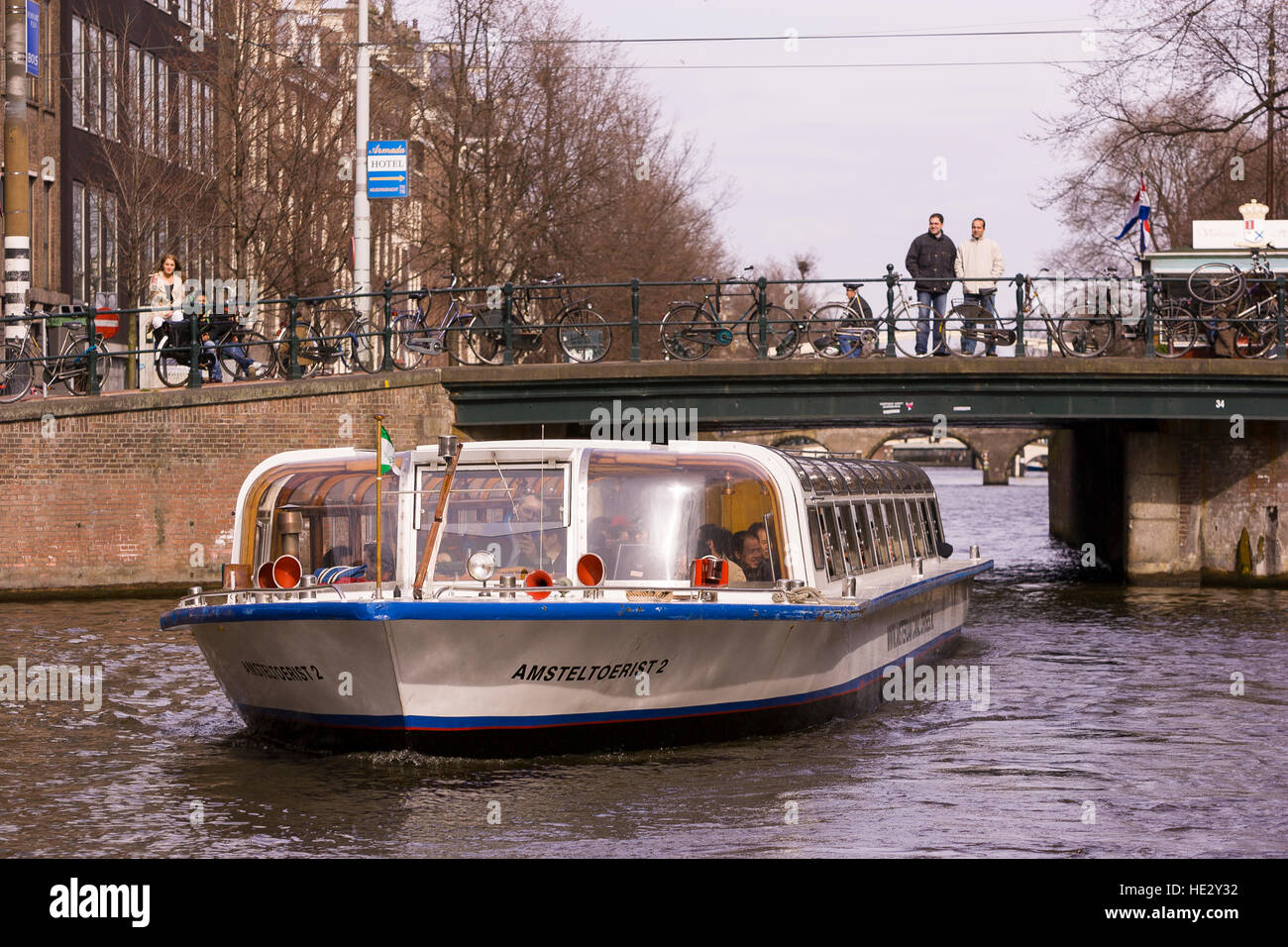 AMSTERDAM, NETHERLANDS - Boat on canal Stock Photo - Alamy