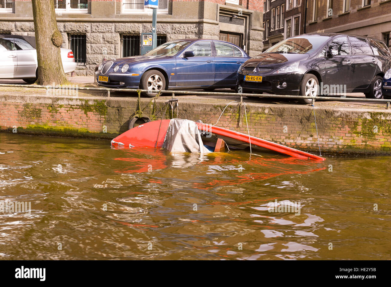 AMSTERDAM, NETHERLANDS - Sunken boat on canal Stock Photo - Alamy