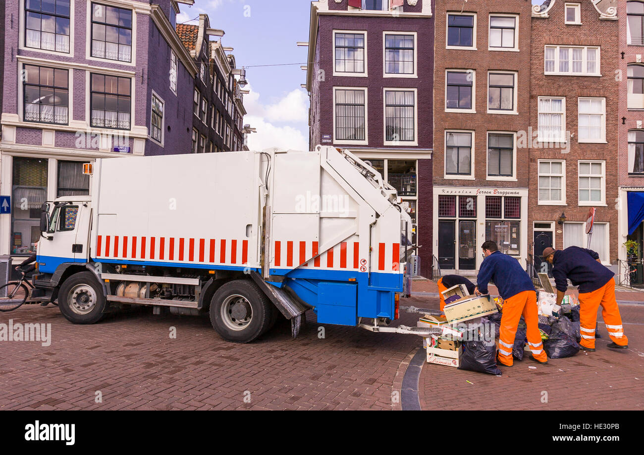 AMSTERDAM, NETHERLANDS - Garbage collection truck and workers Stock ...