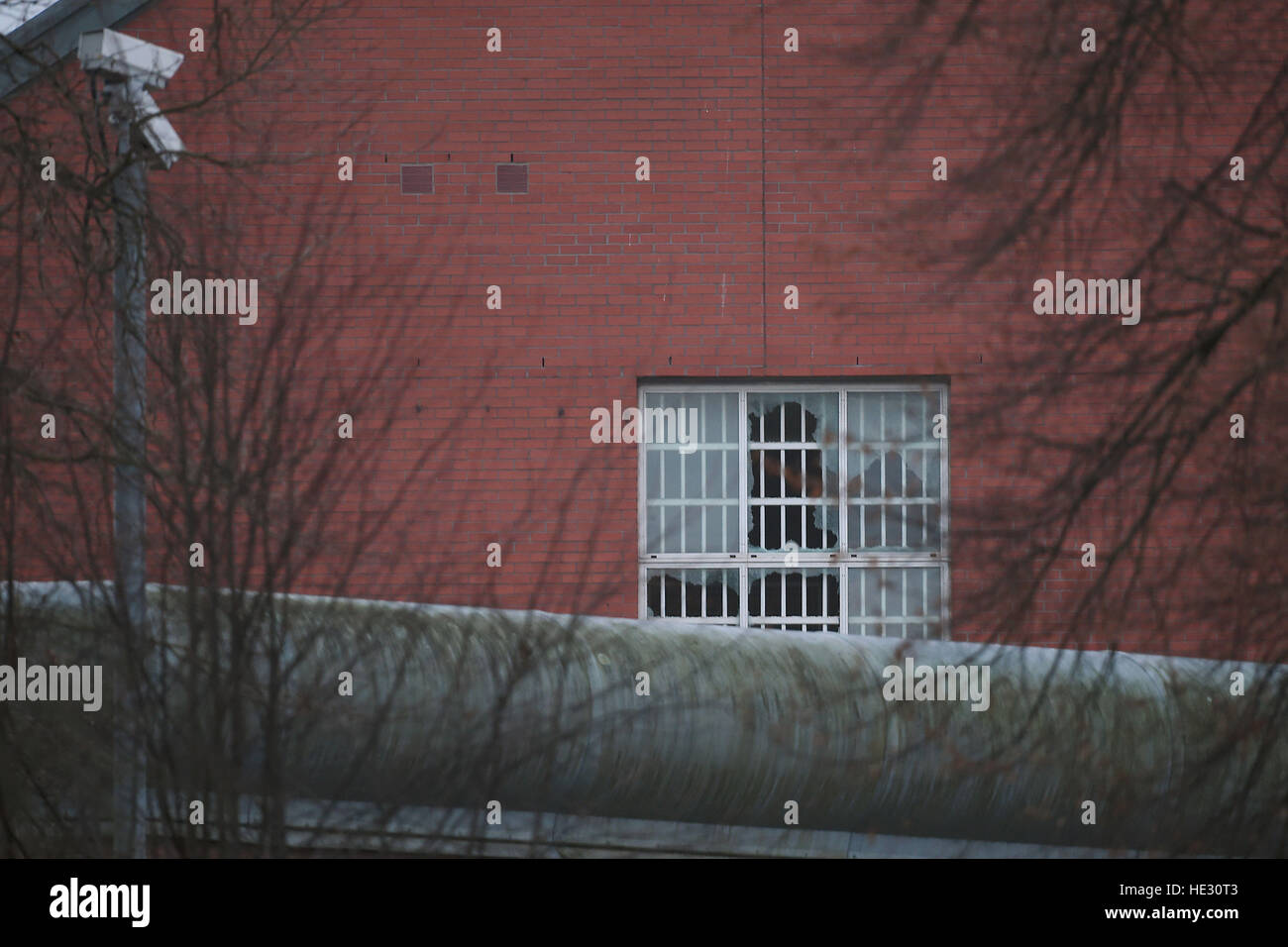 Broken windows at HMP Birmingham where a disturbance is under way. The ...