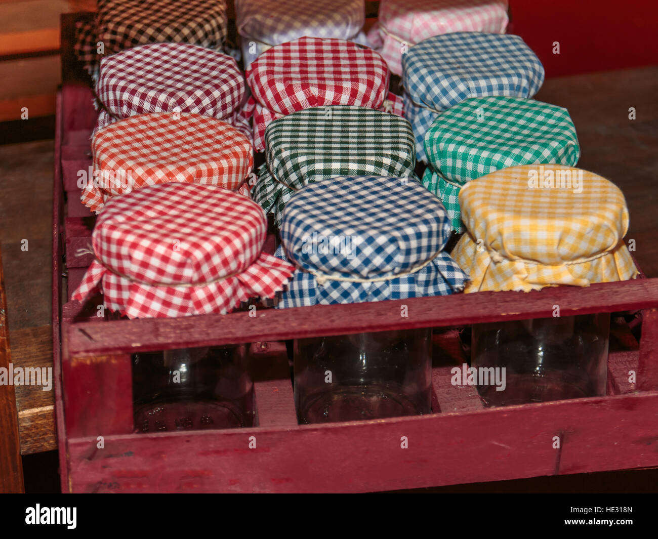 Colorful Fabric Jar Covers in Red Box Stock Photo - Alamy