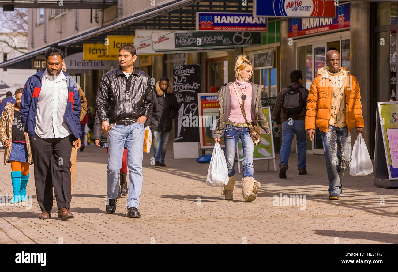BIJLMER, AMSTERDAM, NETHERLANDS - People walking on sidewalk in Bijlmer ...
