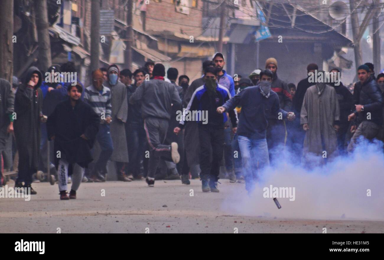 Youth kicking back the tear-smoke shell towards police that was fired ...