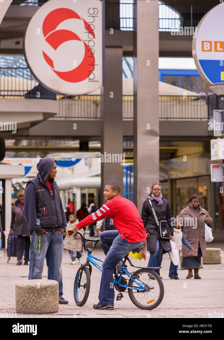 BIJLMER, AMSTERDAM, NETHERLANDS - Young immigrant men at shopping ...