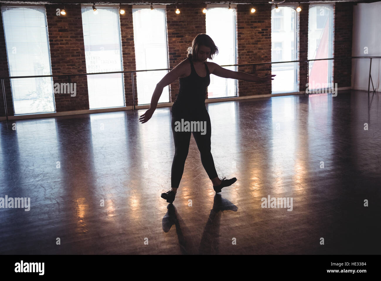 Woman practicing dance in dance studio Stock Photo - Alamy