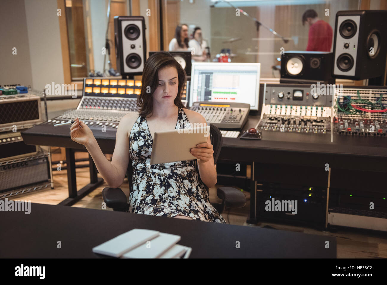 Audio engineer using digital tablet in music studio Stock Photo - Alamy