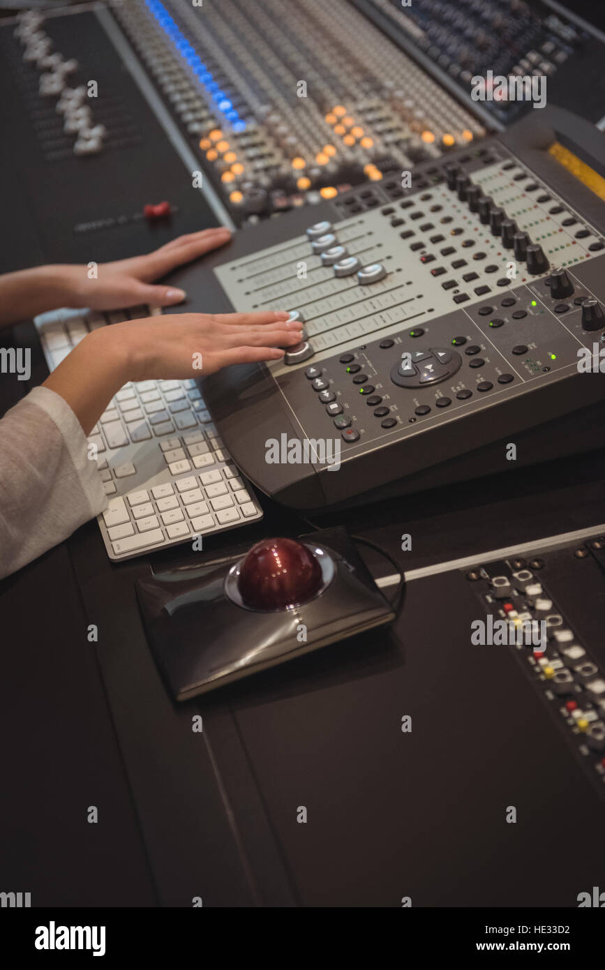 Audio engineer using sound mixer in recording studio Stock Photo - Alamy