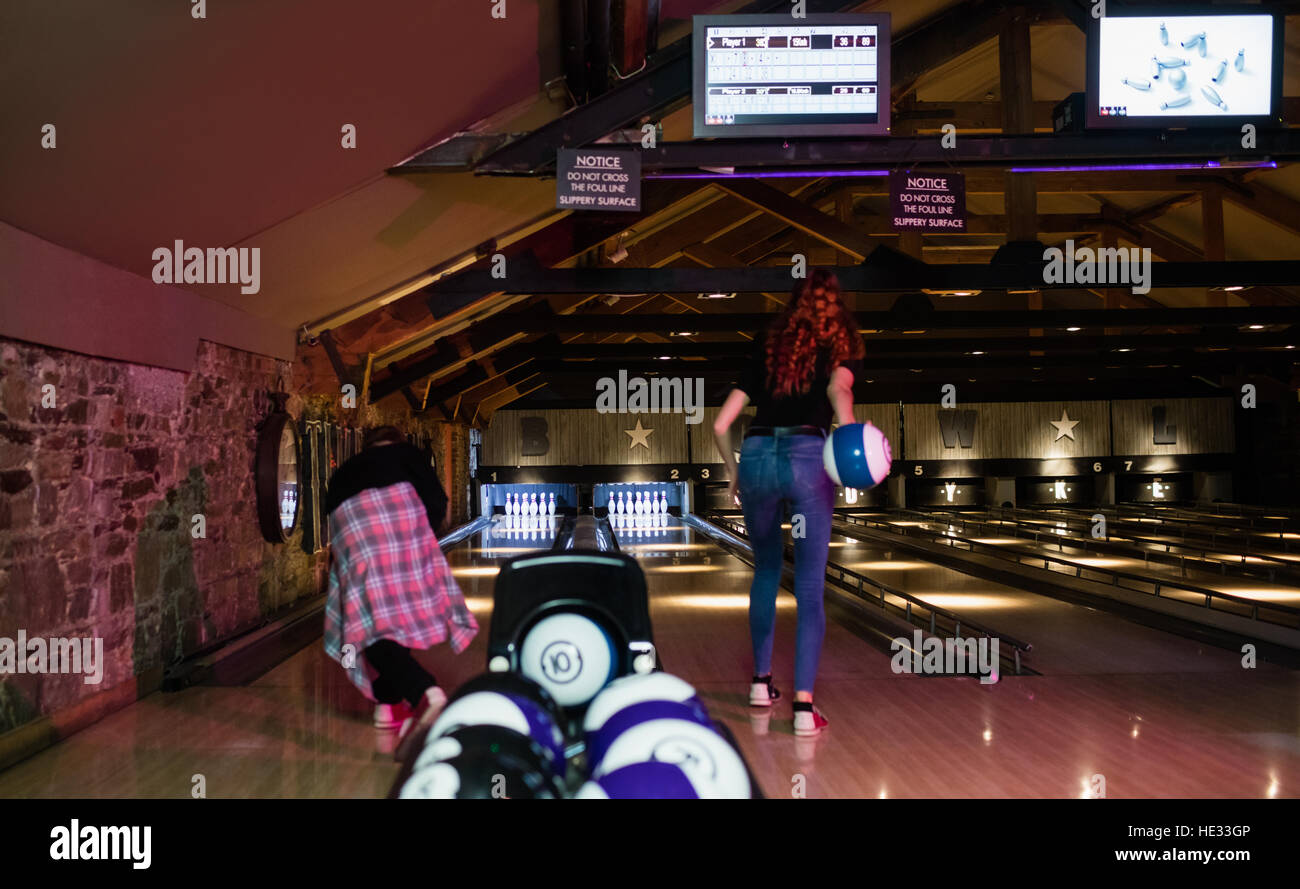 Friends playing bowling in bar Stock Photo - Alamy