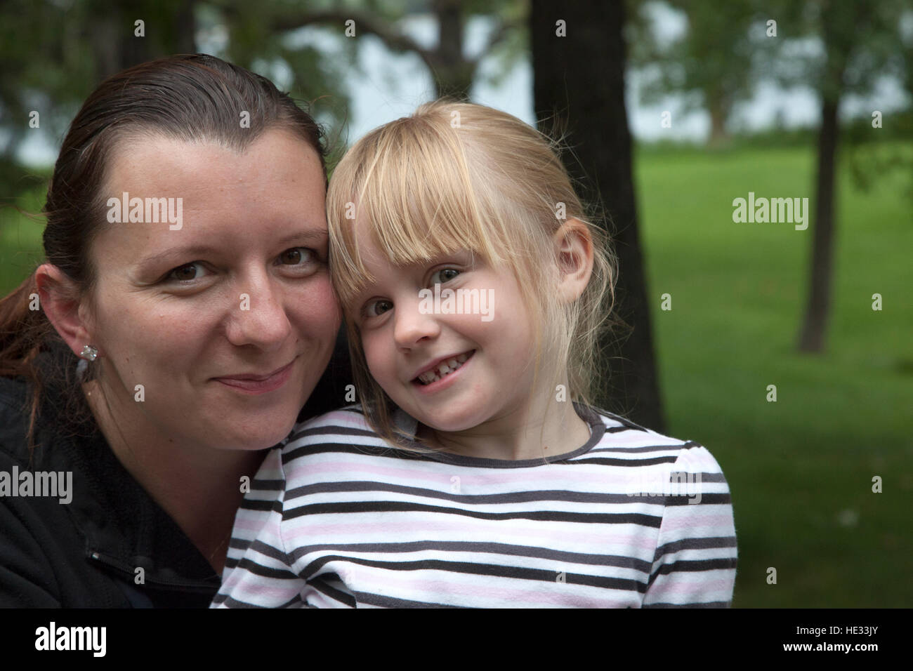 Affectionate happy moment of mother and daughter. Clitherall Minnesota ...