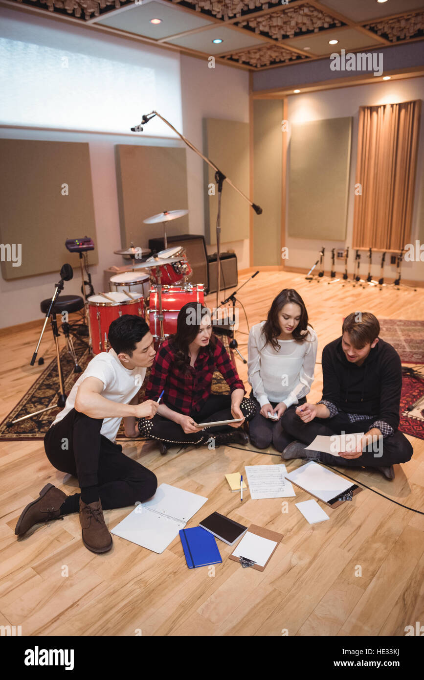 Team of musician composing tune in recording studio Stock Photo - Alamy