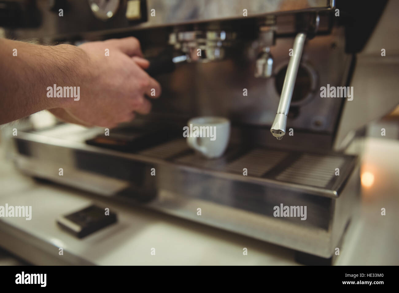 Hand of man preparing coffee at coffee machine in the coffee shop Stock ...