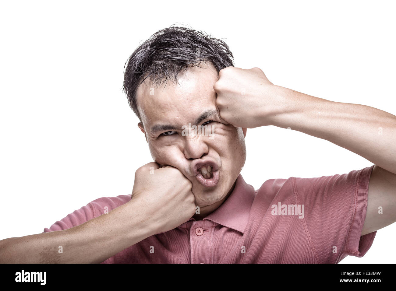 Facial expression : man punching his face Stock Photo - Alamy