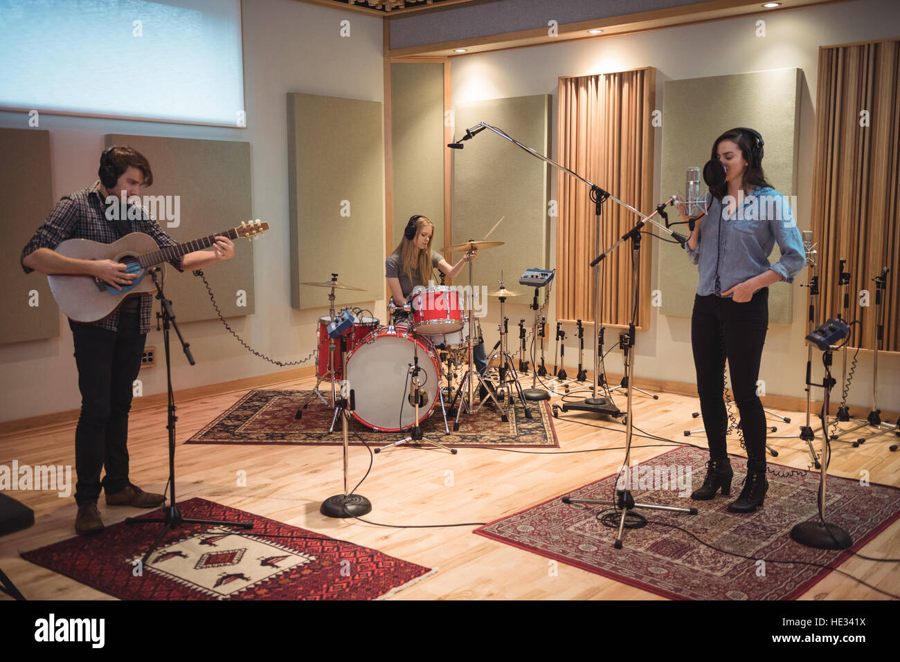 Music band performing in music studio Stock Photo - Alamy