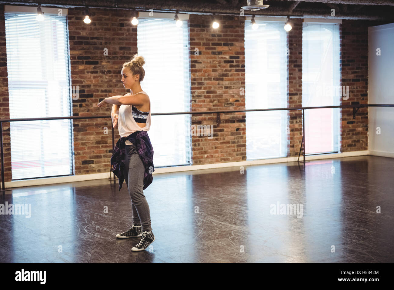 Woman practicing a dance moves in dance studio Stock Photo - Alamy