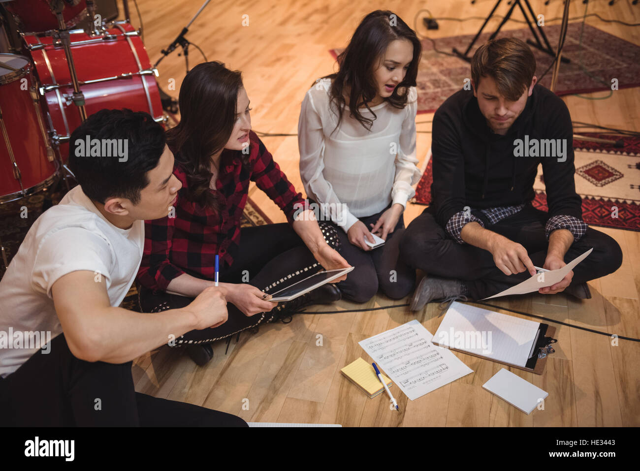Team of musician composing tune in recording studio Stock Photo - Alamy