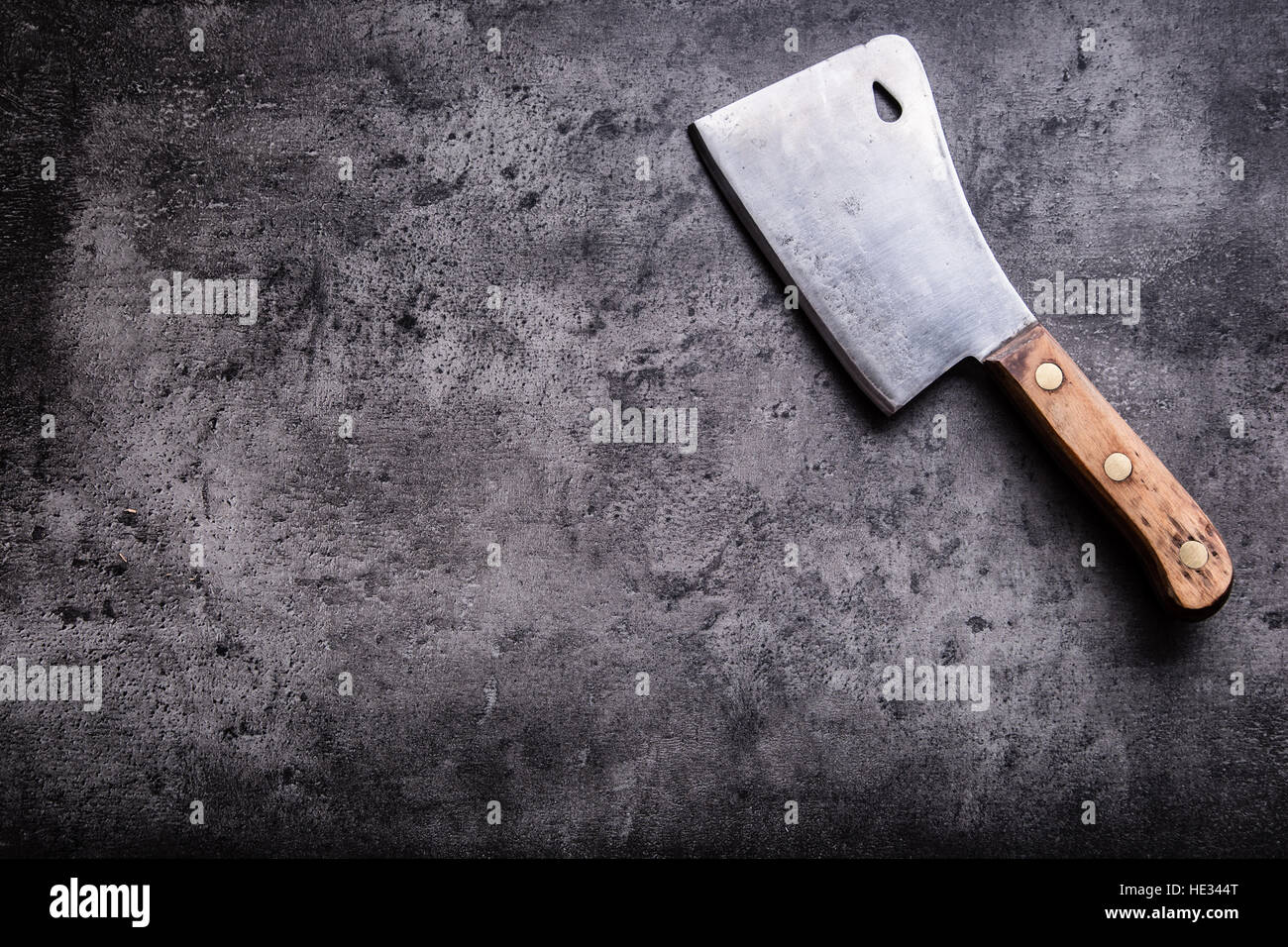 Butcher. Vintage butcher meat cleavers with cloth towel on dark ...