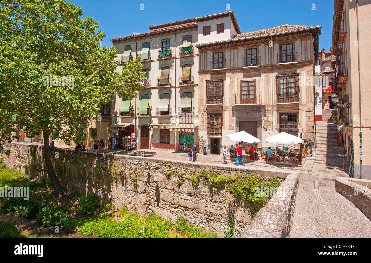 Buildings and a cafe along the Darro River in Granada, Spain Stock ...
