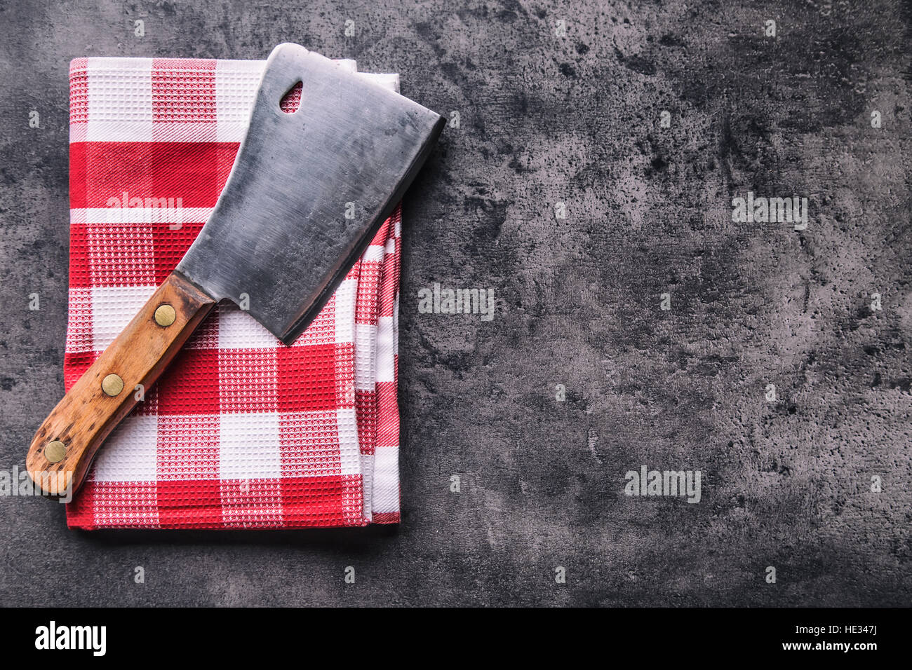 Butcher. Vintage butcher meat cleavers with cloth towel on dark ...